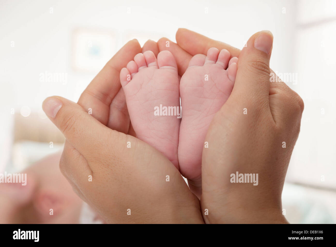 Two babys feet hi-res stock photography and images - Alamy