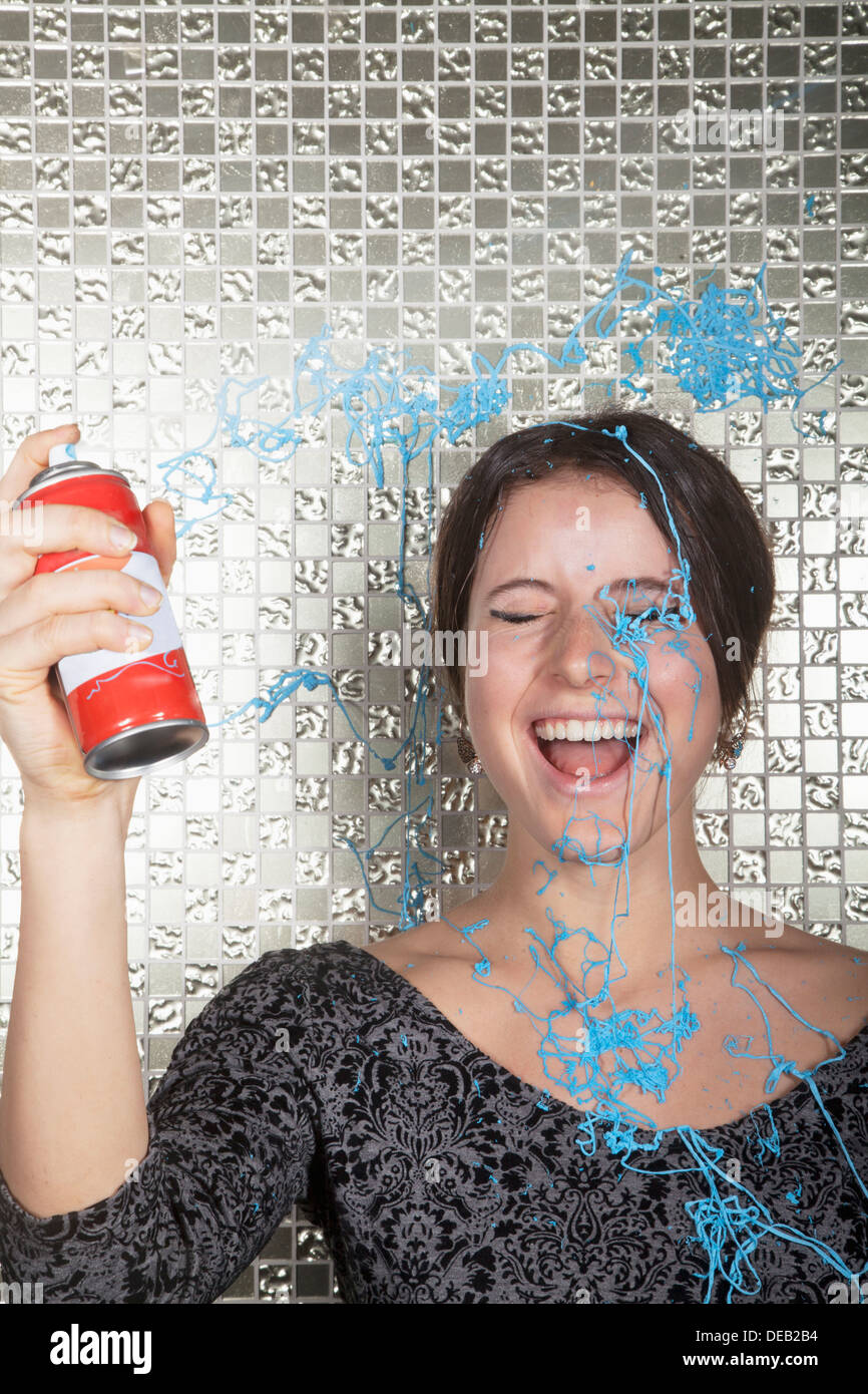 Portrait young woman spraying hi-res stock photography and images - Alamy