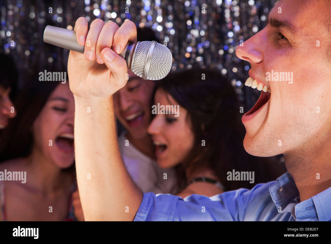 Side profile young man singing hi-res stock photography and images - Alamy