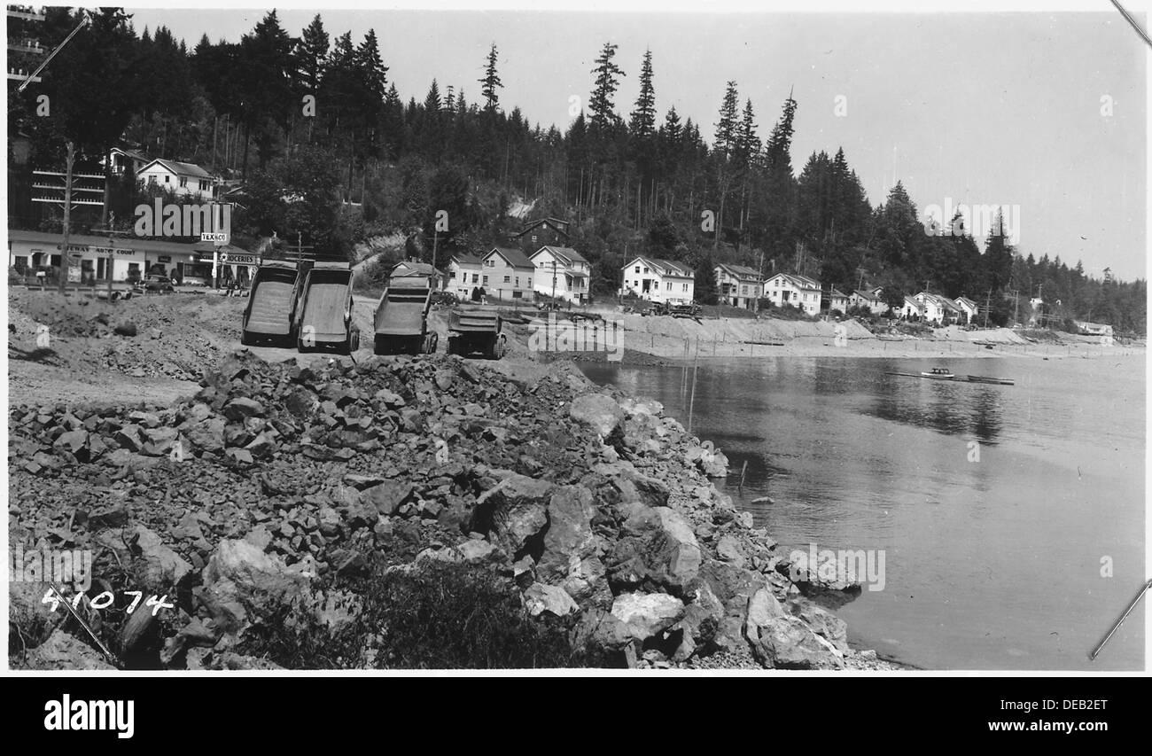 The image shows a rock fill slope protection system at Sta. 75, with ...