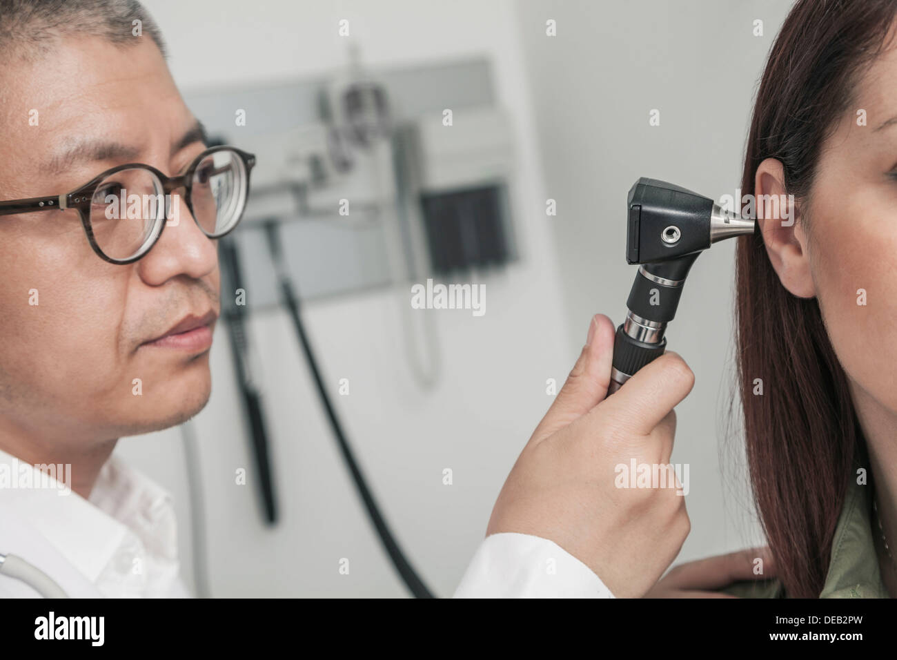 Checking ears hi-res stock photography and images - Alamy