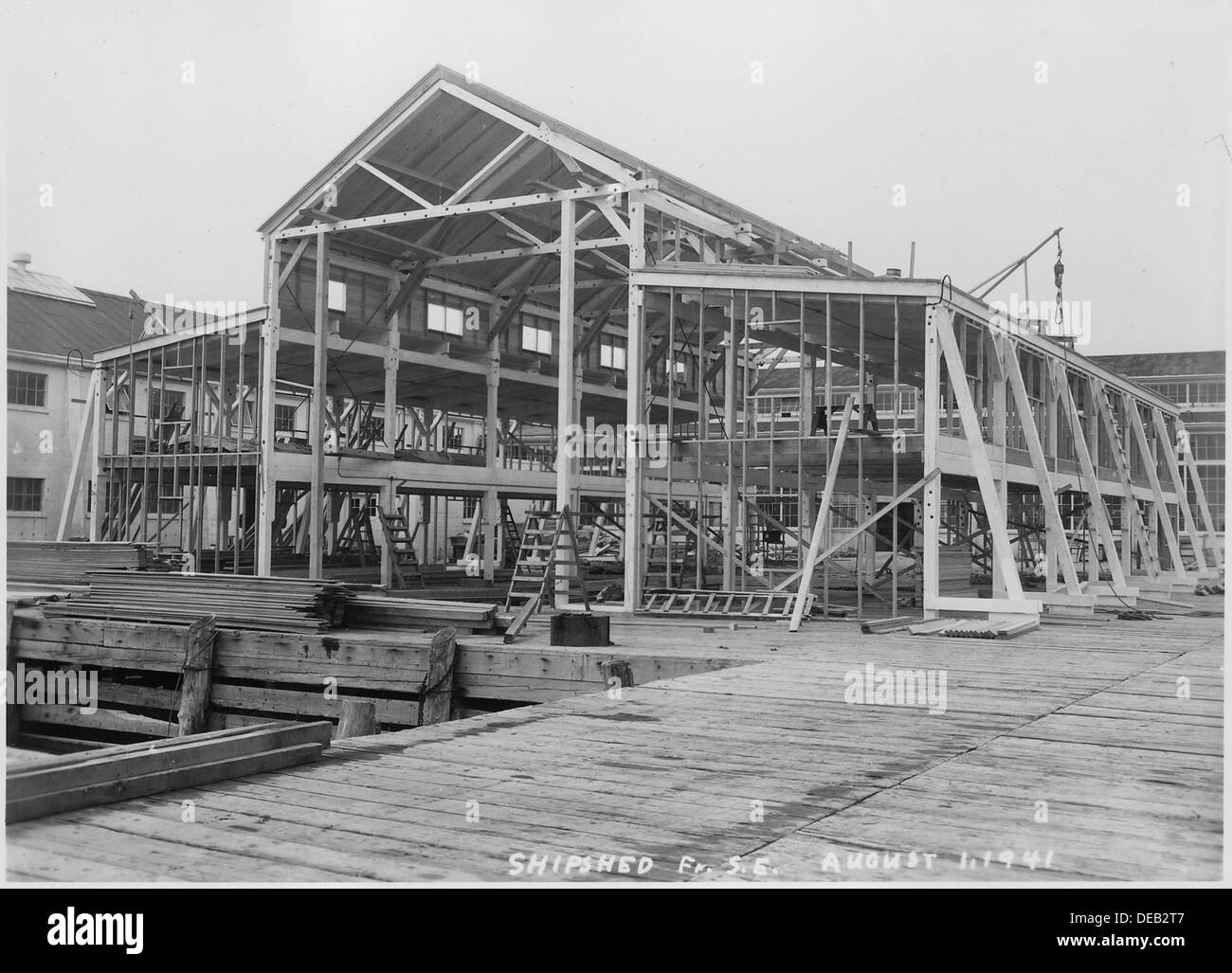 A wartime shipshed under construction is captured in this photograph ...