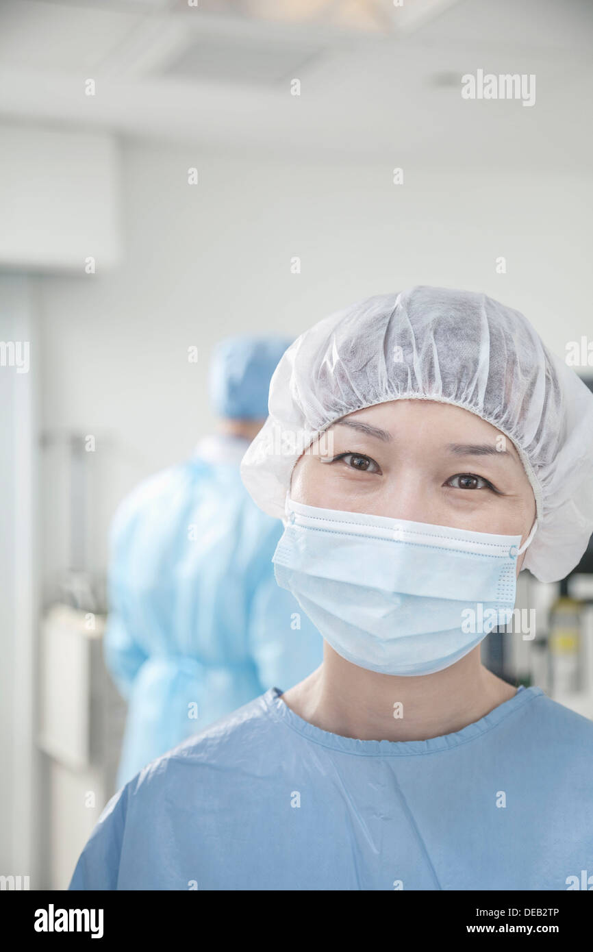 Portrait of surgeon with surgical mask and surgical cap in the ...