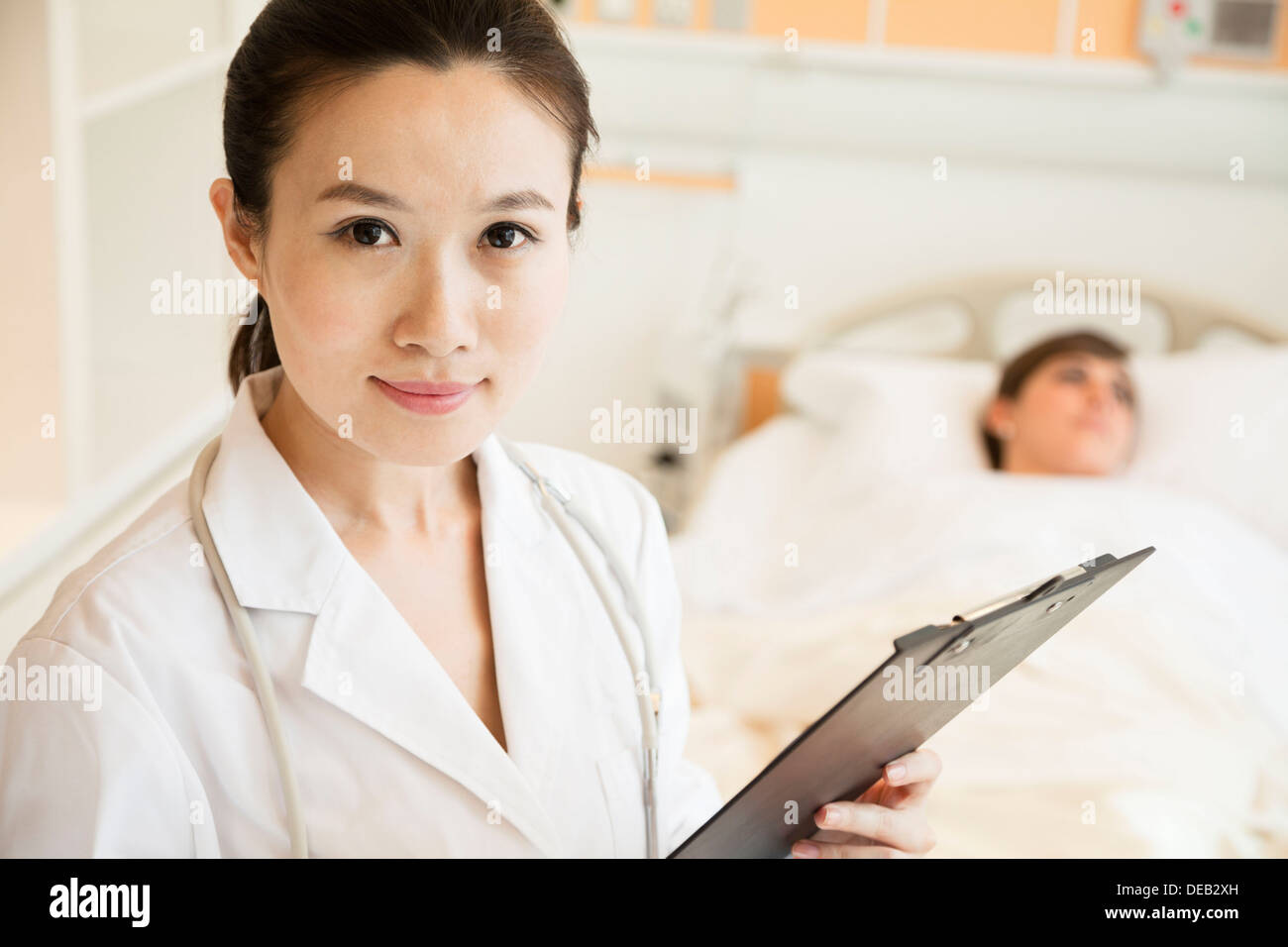 Lying on back looking at camera holding healthcare and medicine hi-res ...