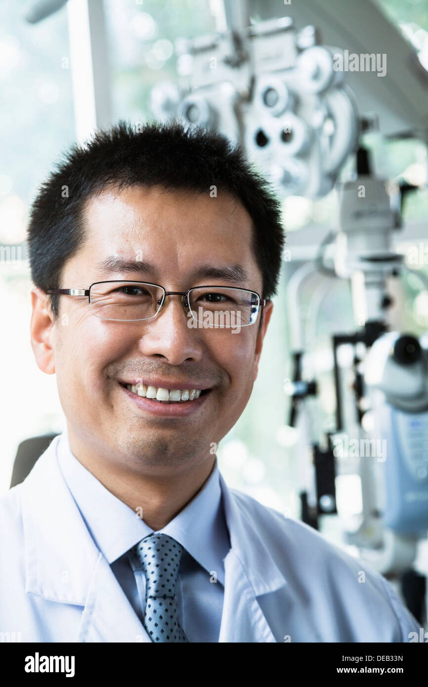 Portrait of smiling optometrist in his clinic Stock Photo - Alamy