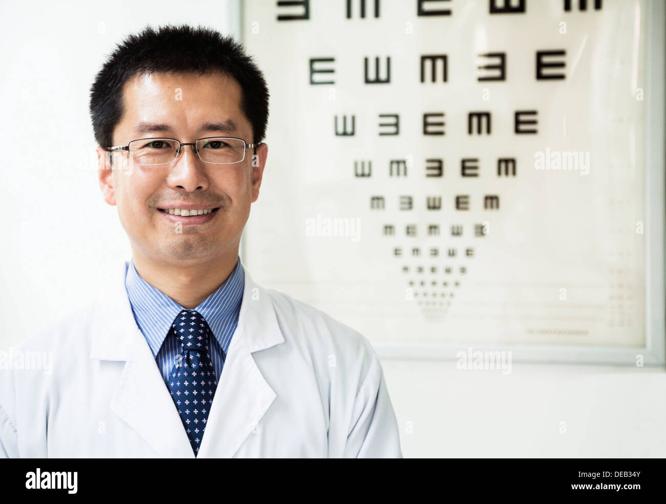 Professional smiling optometrist in hi-res stock photography and images ...