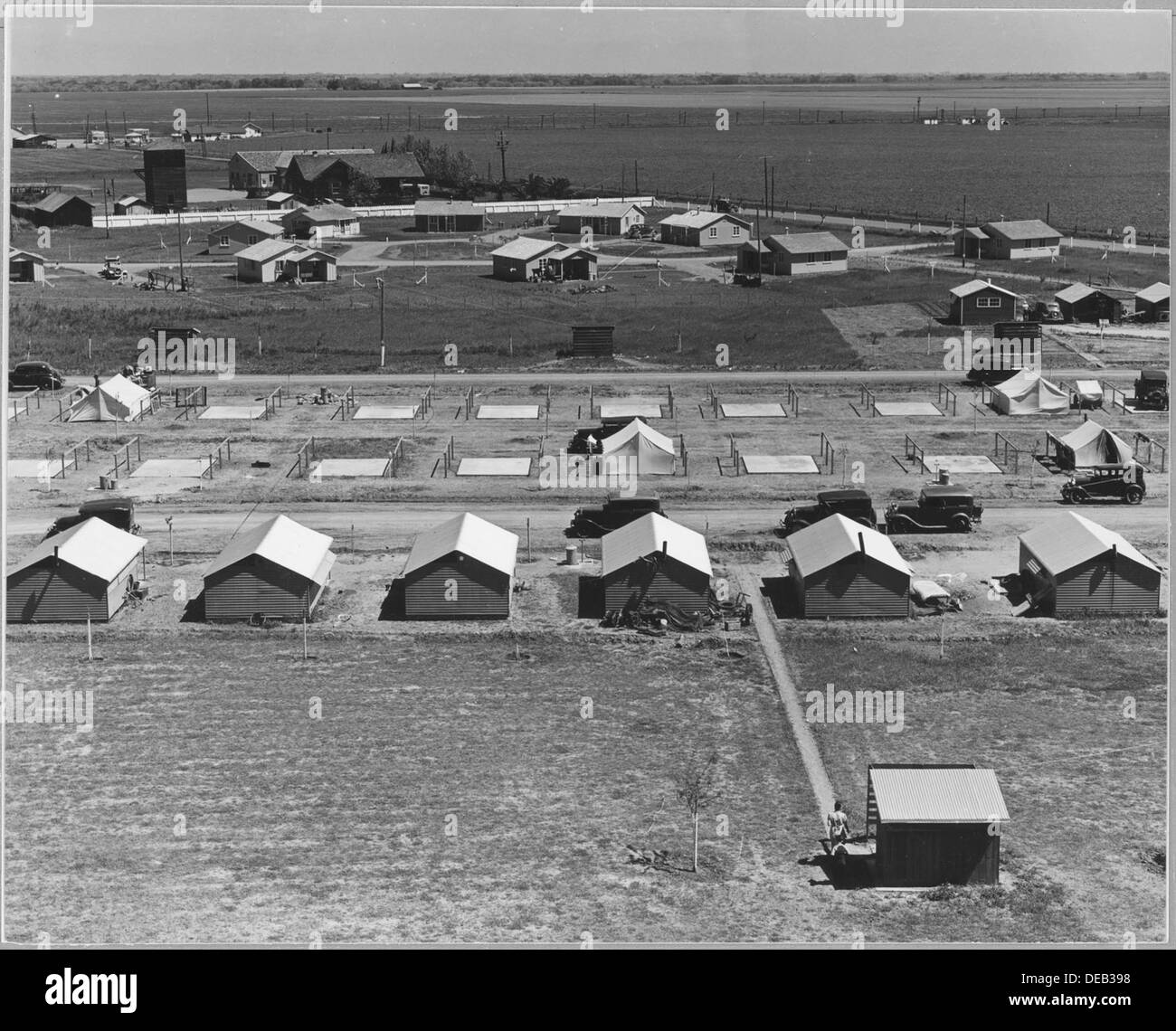 The image shows a migratory labor camp in Westley, Stanislaus County ...