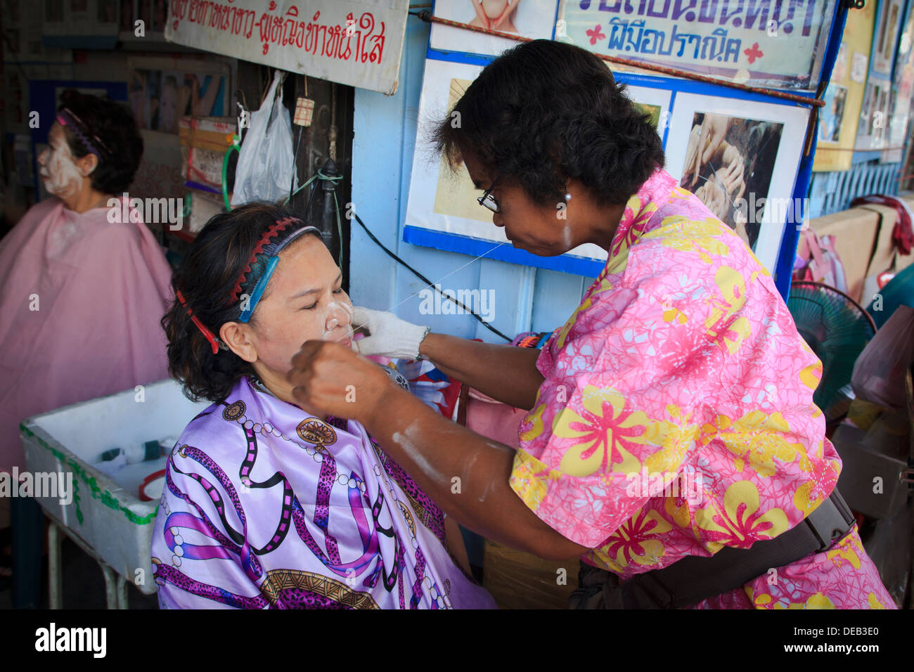Facial epilation with the ancient method of threading. Chinatown ...