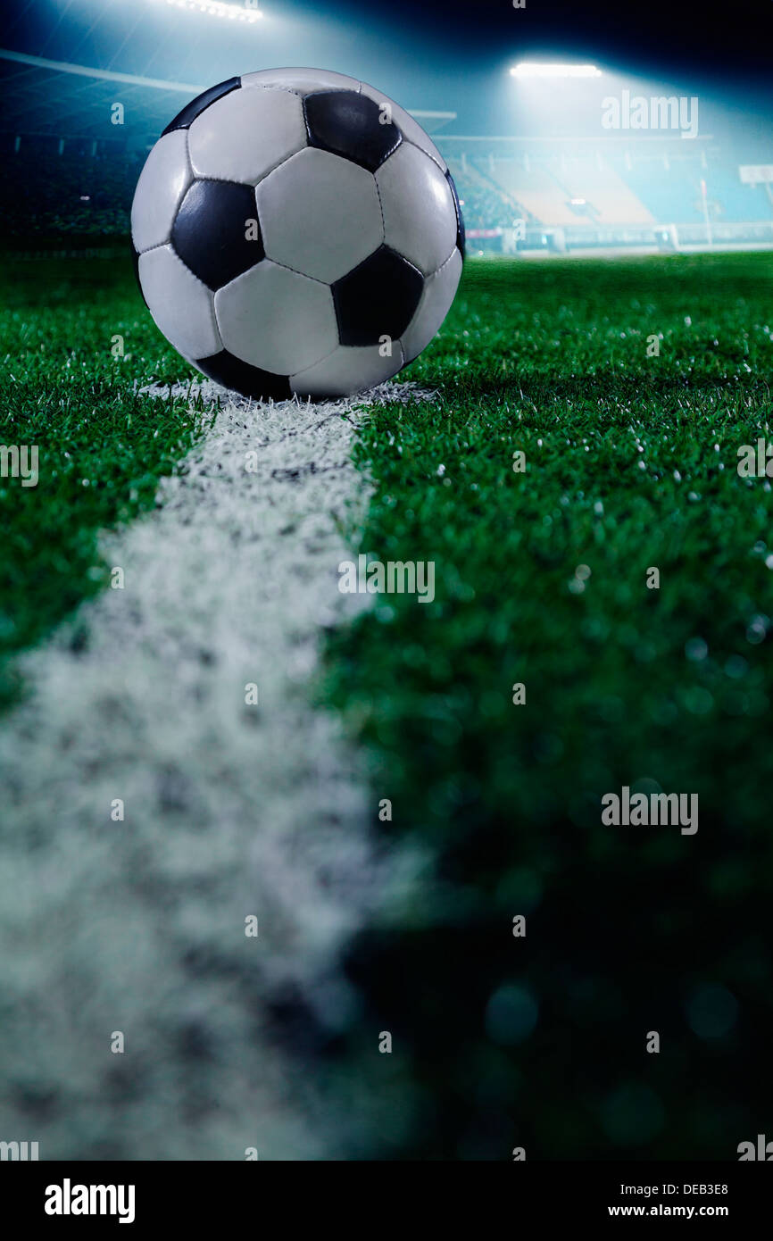 Soccer field with soccer ball and line, side view Stock Photo - Alamy