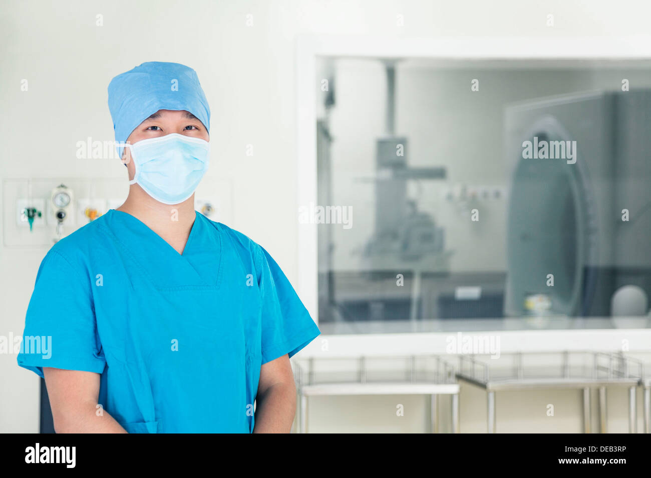 Portrait of young surgeon wearing surgical mask in the operating room ...