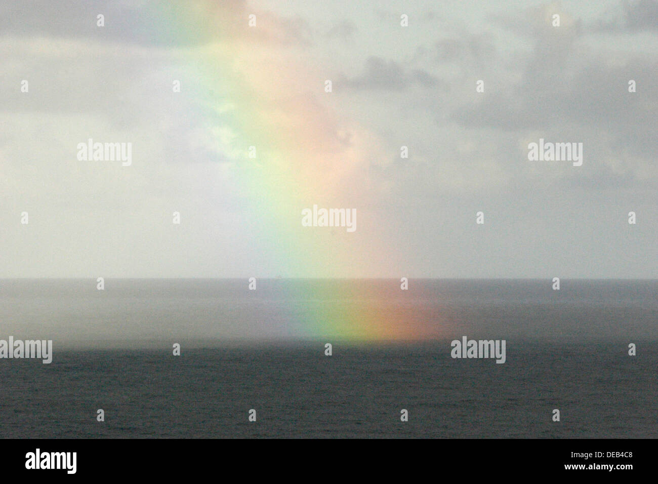 Rainbow On Sea Stock Photo - Alamy