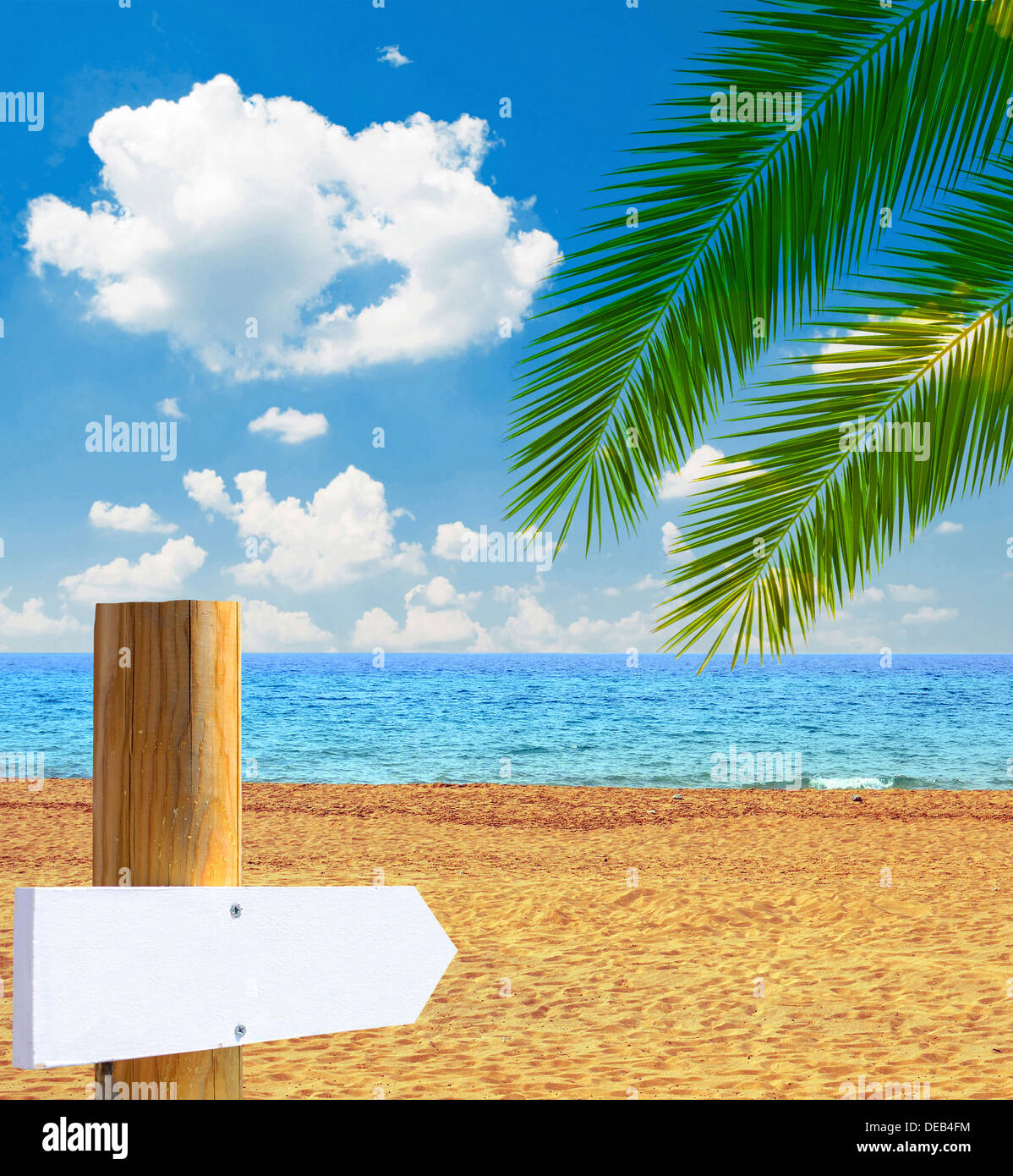 Paradise beach with empty wooden sign Stock Photo - Alamy