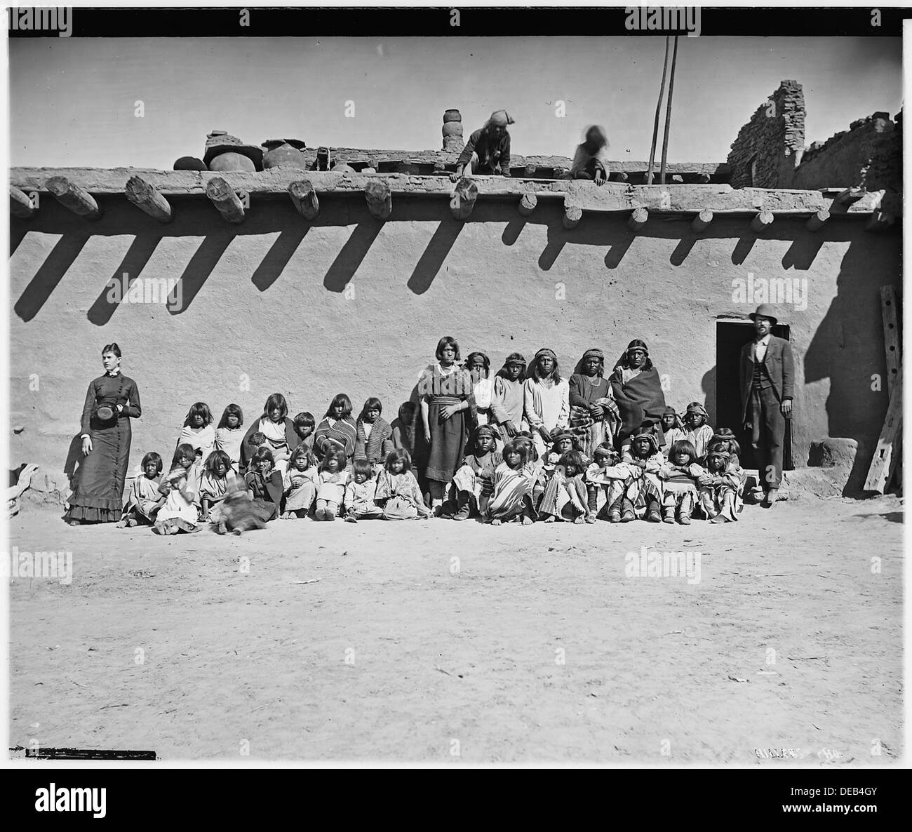 A group of Zuni school children is shown in a traditional educational ...