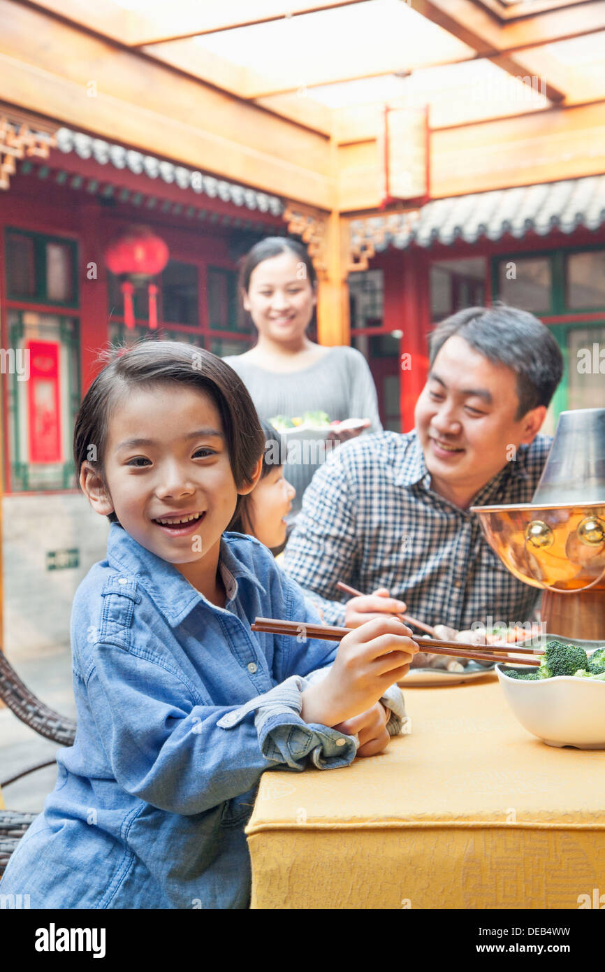 Chinese family eating with chopsticks hi-res stock photography and ...