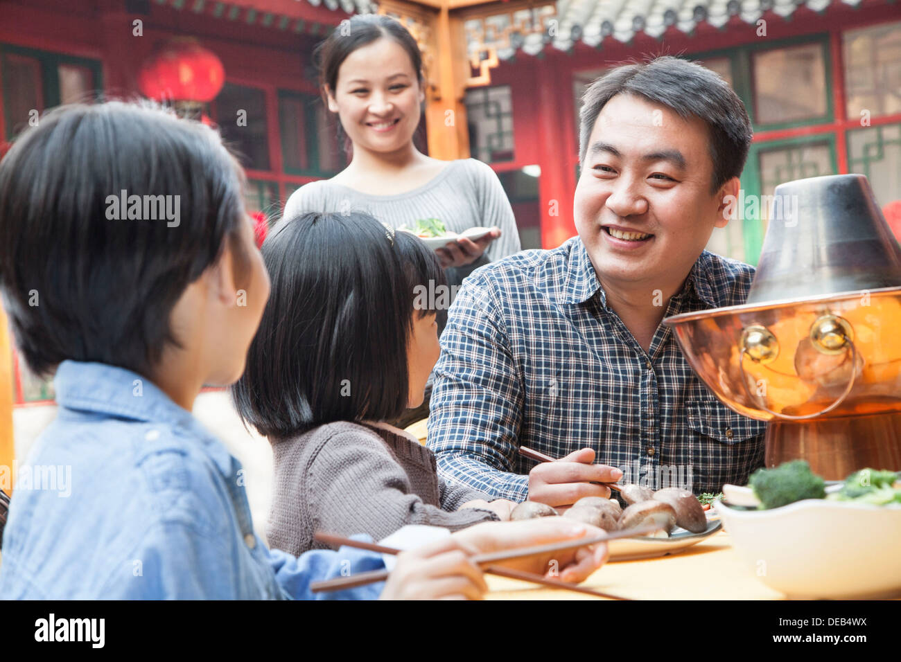 Family enjoying a traditional Chinese meal Stock Photo - Alamy