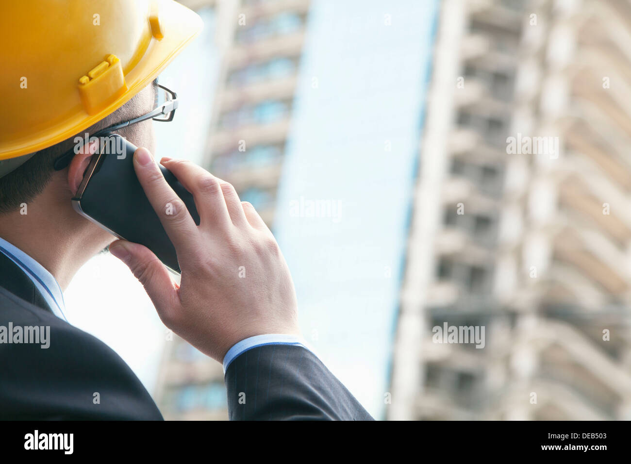 Architect on the phone at a construction site Stock Photo - Alamy