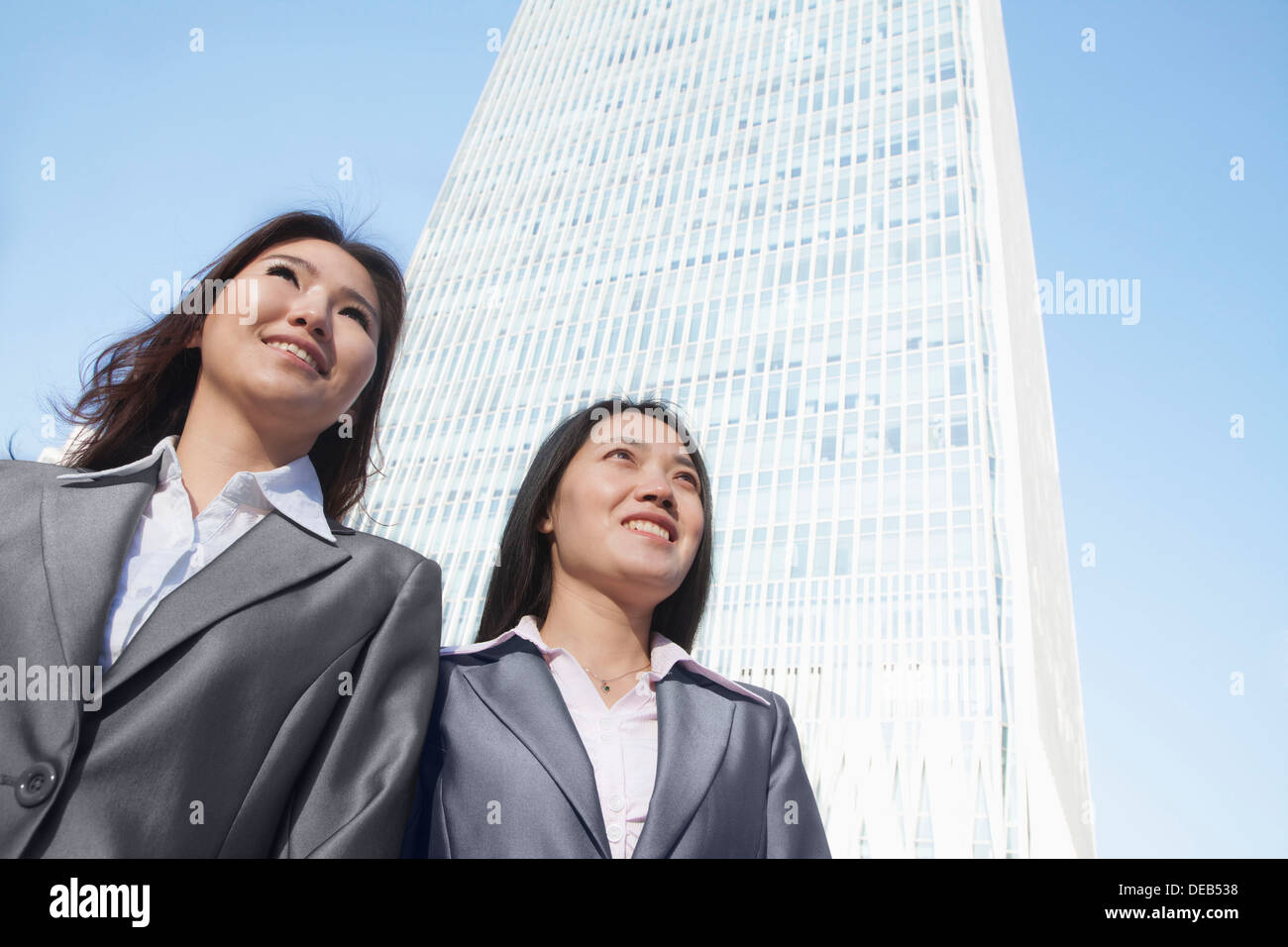 Two businesswomen standing in front of Chinas world trade center in ...