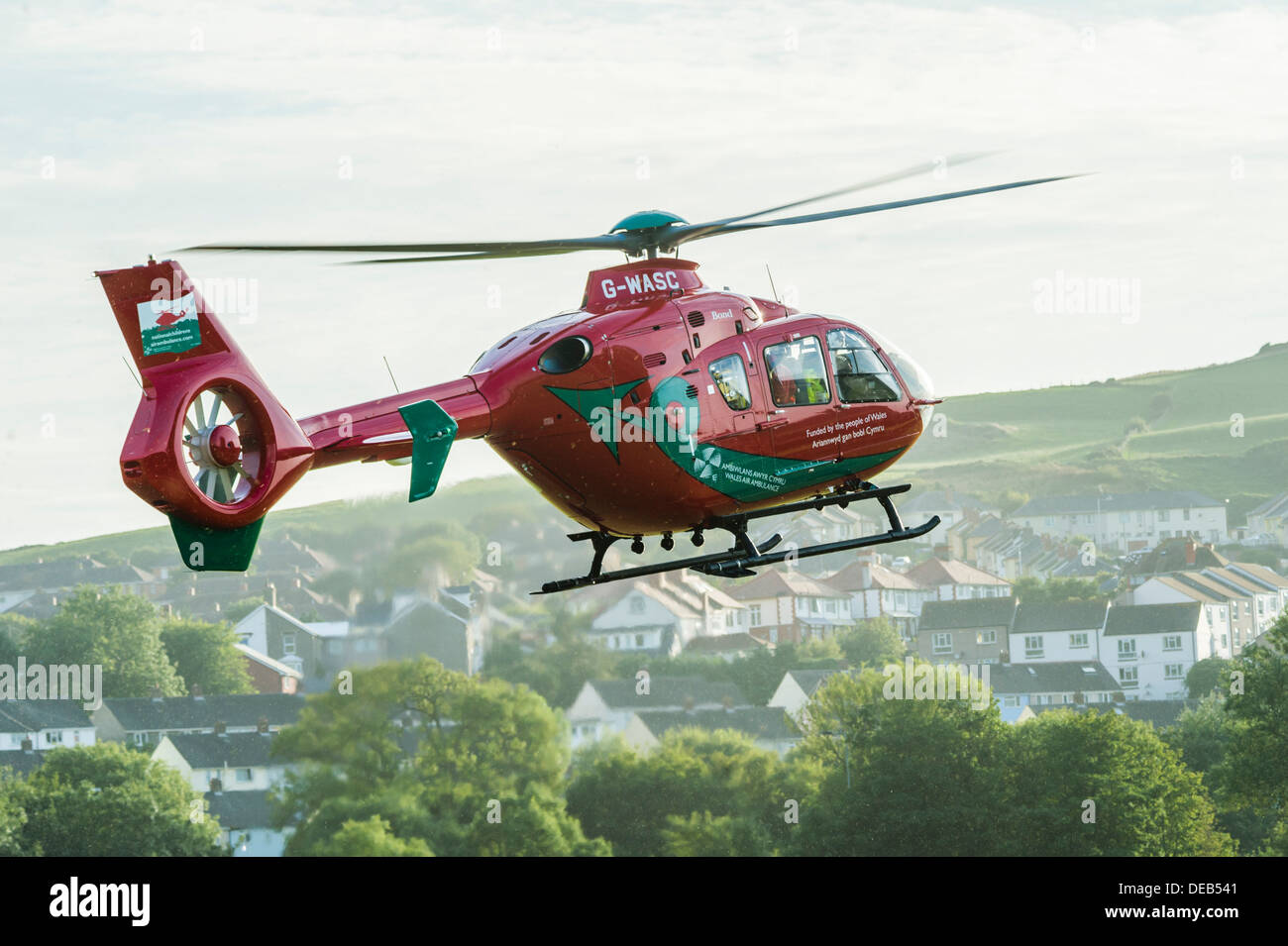 Wales Air Ambulance Service helicopter taking off after delivering a ...