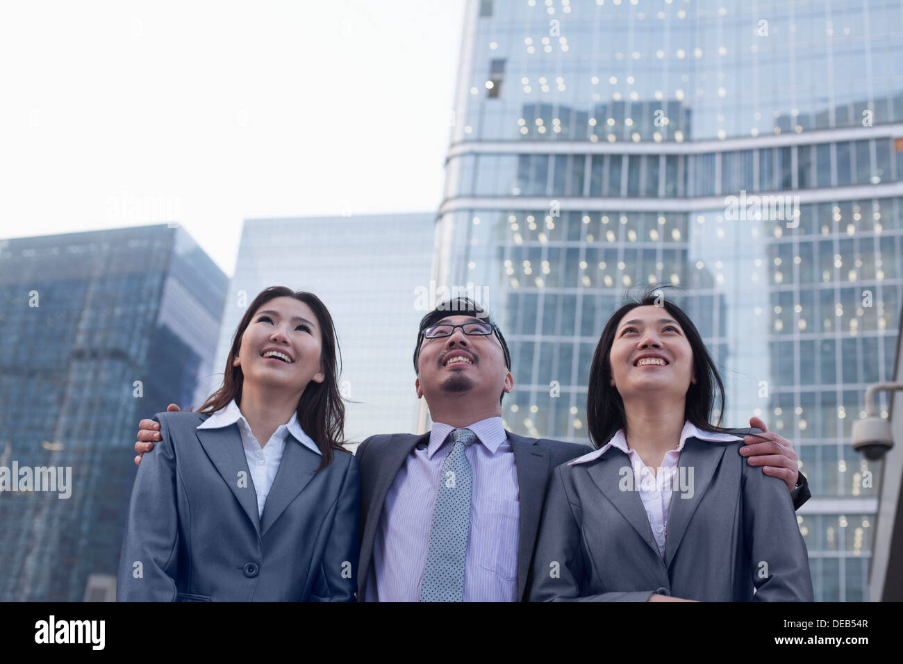 Portrait of smiling business people in a row outdoors, Beijing Stock ...