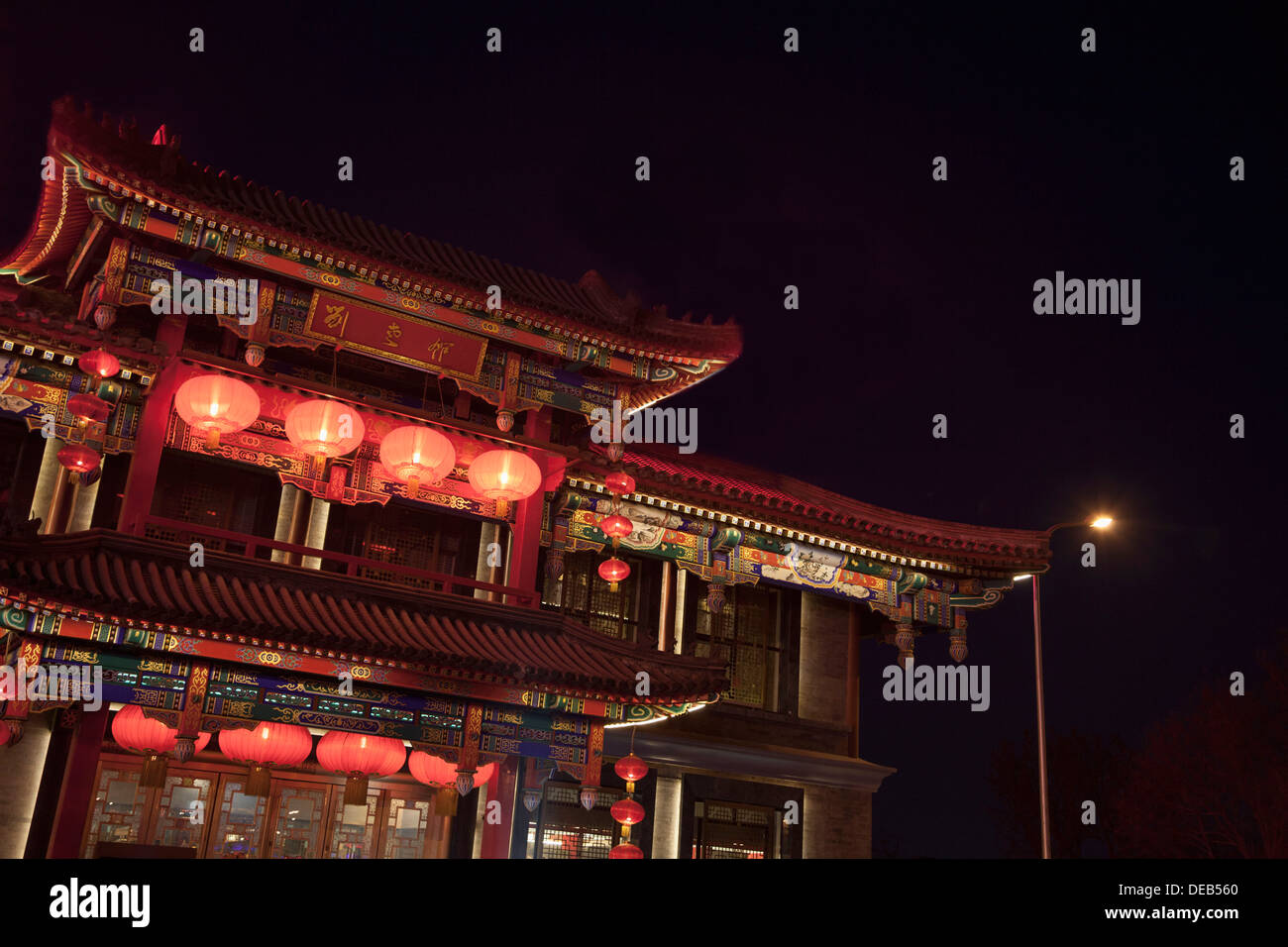 Traditional Chinese building illuminated at night in Beijing, China ...