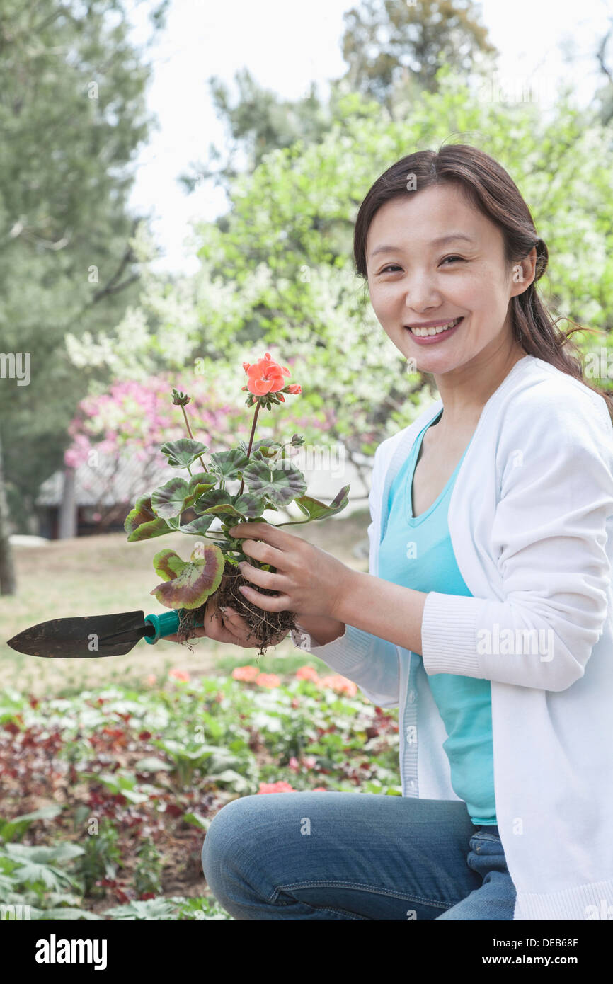Person sitting urban garden flowers hi-res stock photography and images ...