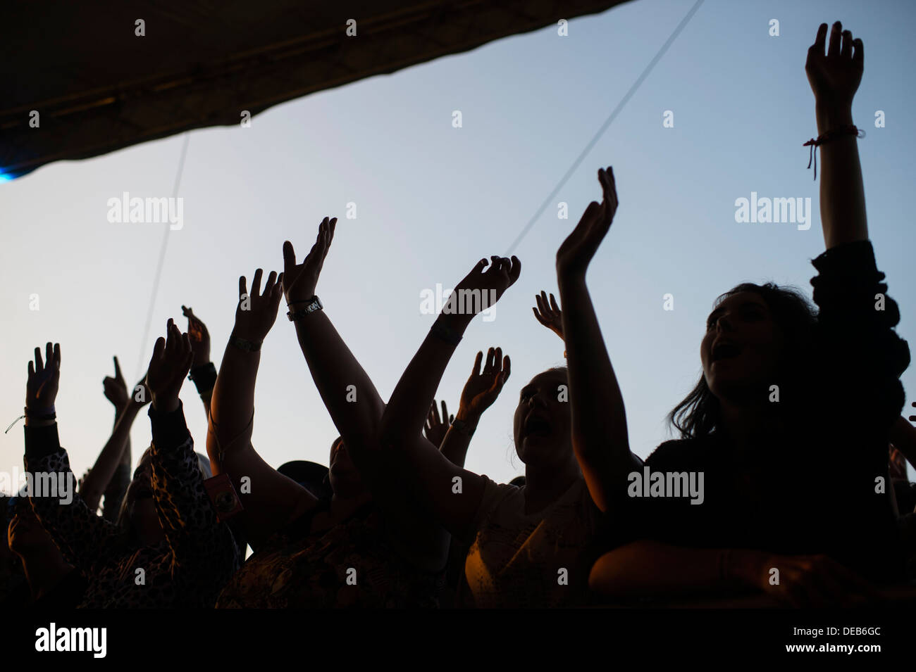 Crowds of people waving their arms enjoying the music at the Big ...