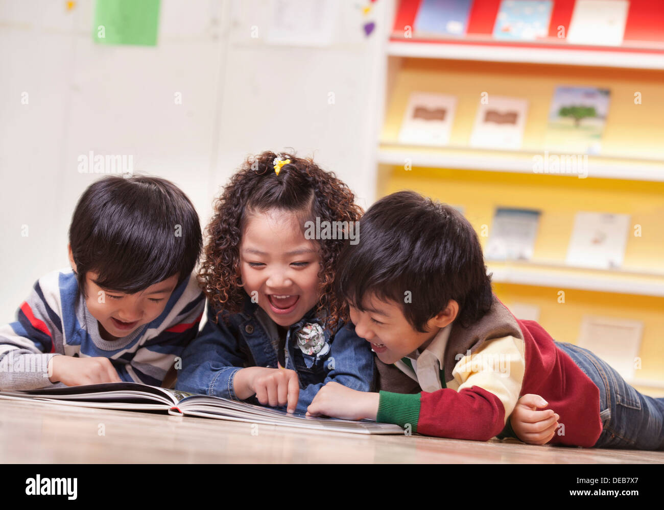 Three Students Reading Stock Photo - Alamy