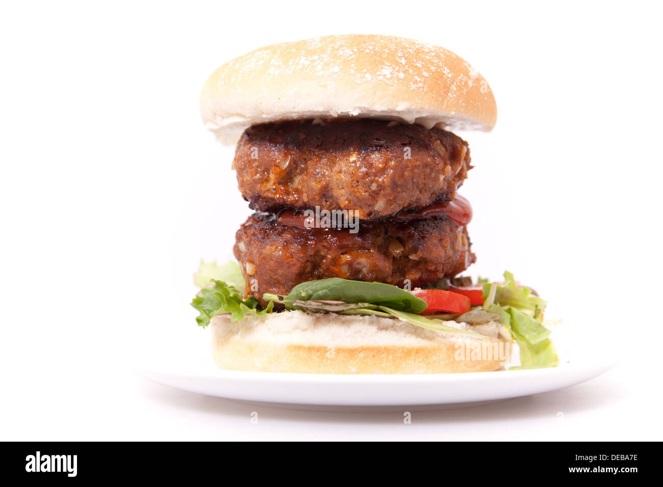 Close up double beef burger on the plate in white background Stock ...