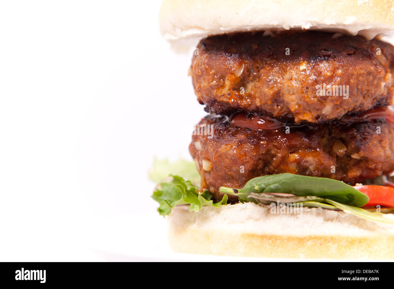 Macro picture of double beef burger in white background Stock Photo - Alamy