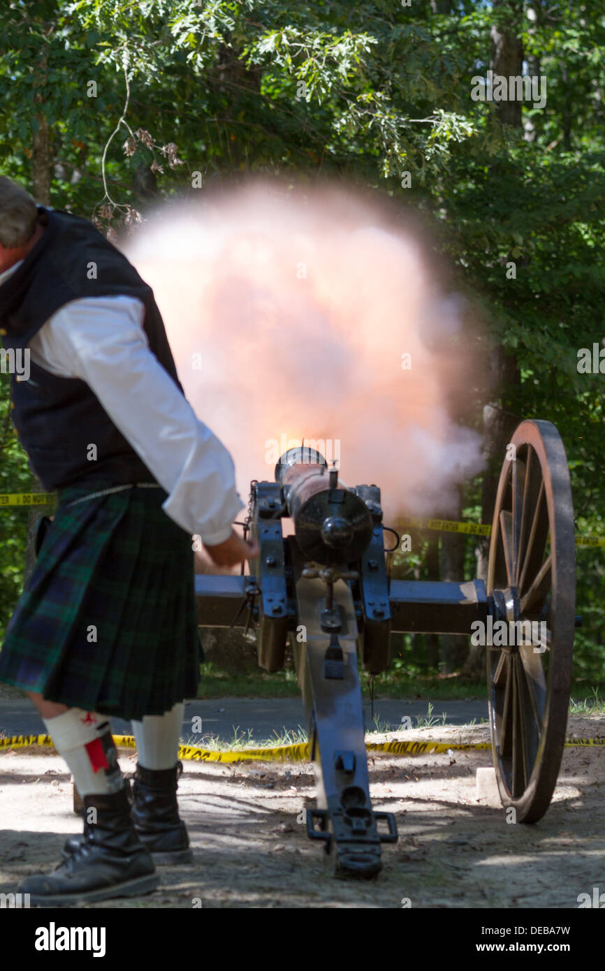 Fire and smoke as a Civil War reenactor fires a functional, 19th ...