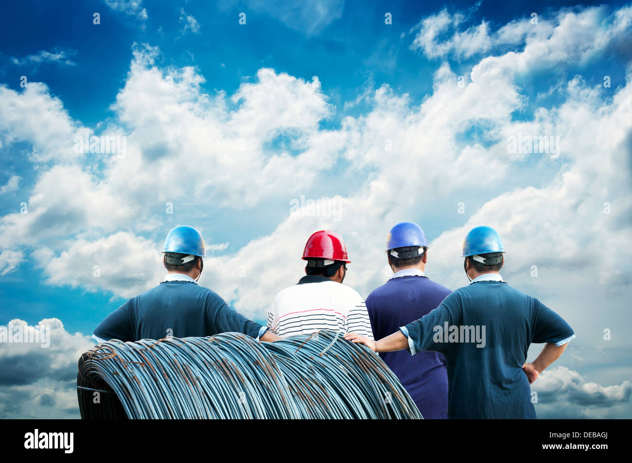 back of workers with blue sky Stock Photo - Alamy
