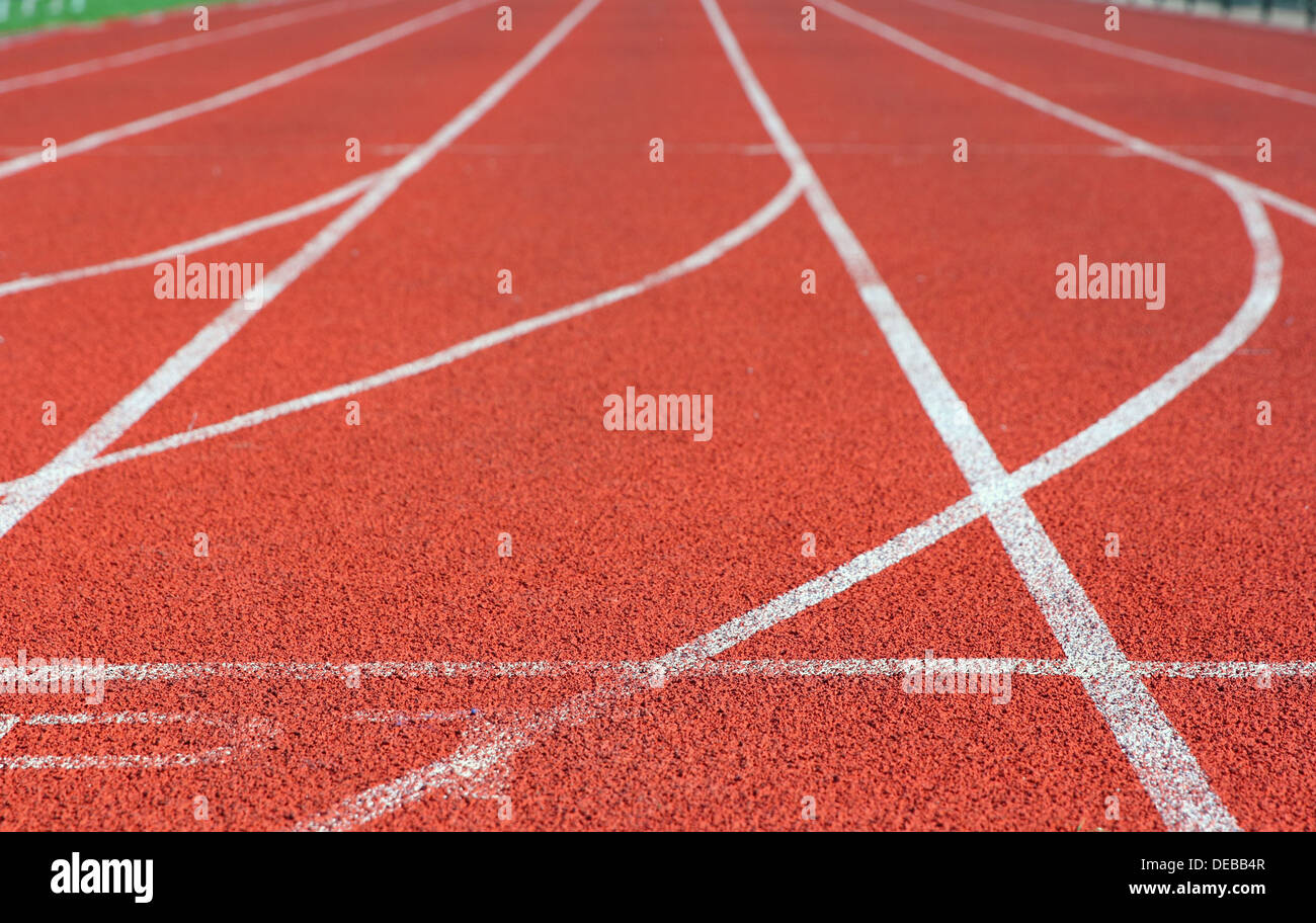 Red treadmill at the stadium with white lines Stock Photo - Alamy