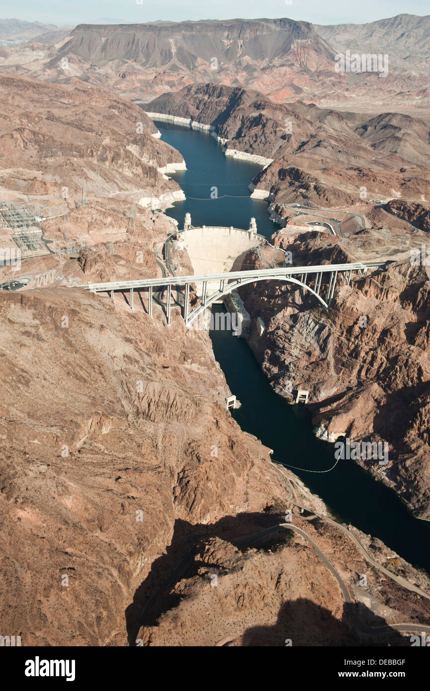A high-top view of a Hoover Dam going across a river in the Grand ...