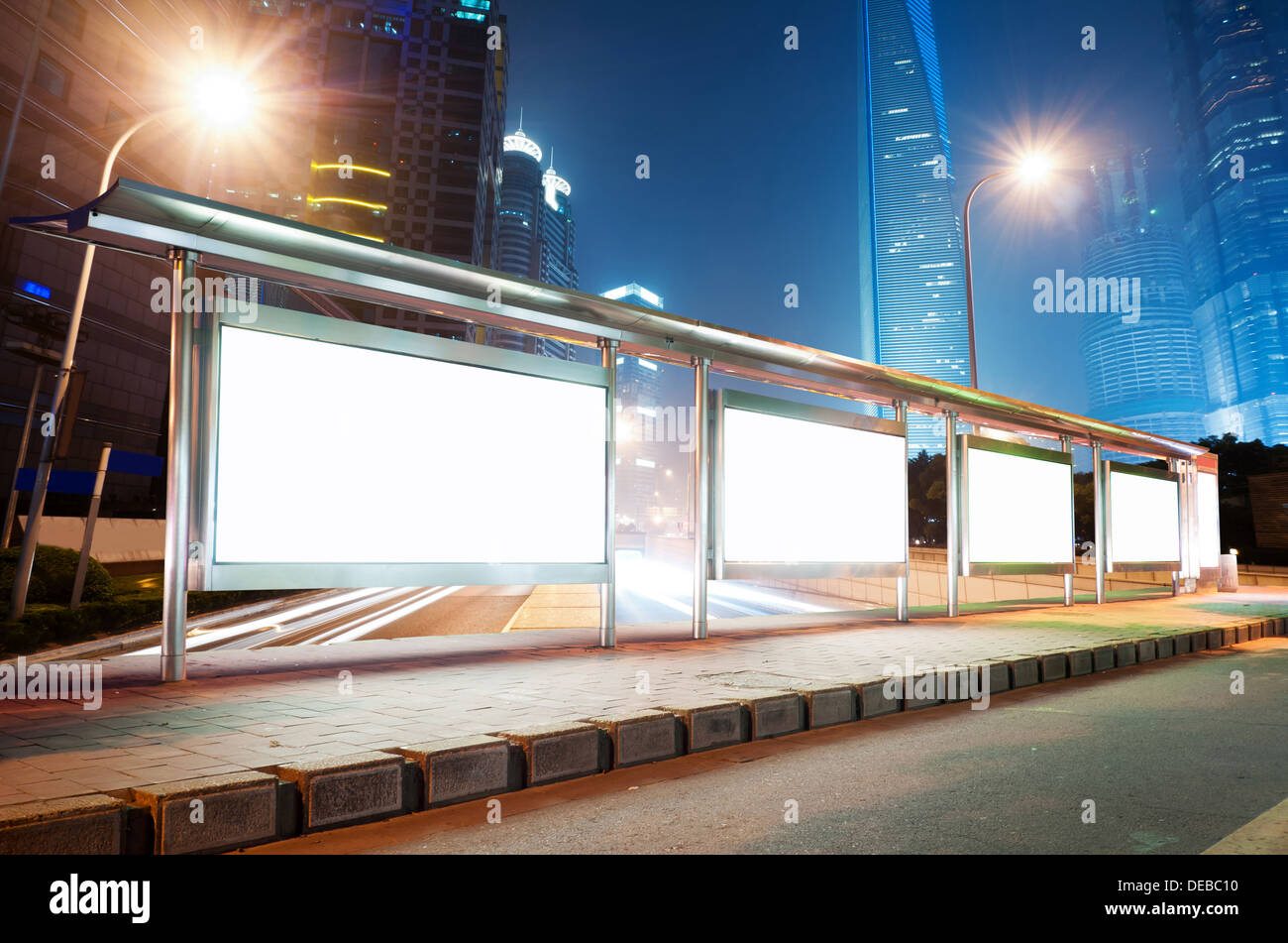 Blank billboard on bus stop at night Stock Photo - Alamy
