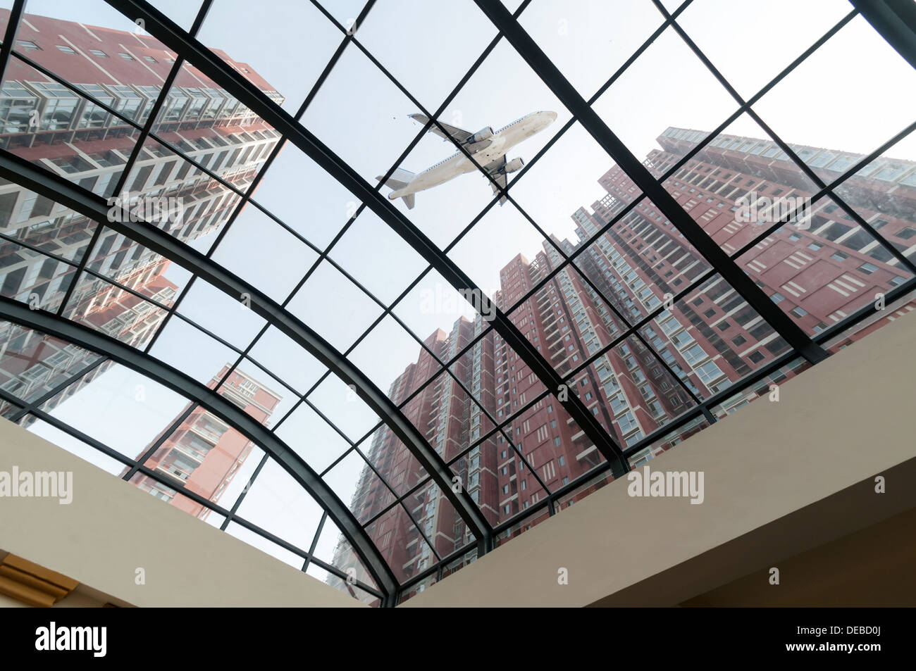 the airplane with the city scene background Stock Photo - Alamy