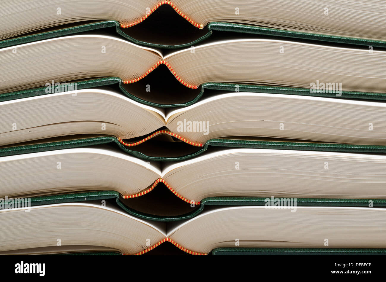 five books opened and stacked on each other Stock Photo - Alamy