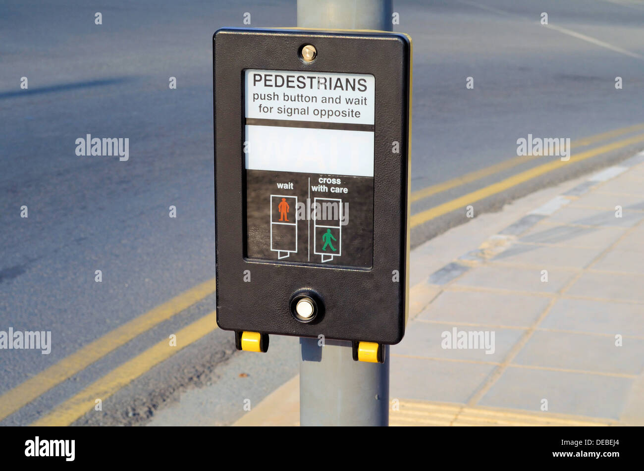 pedestrian crossing button with wait sign Stock Photo - Alamy