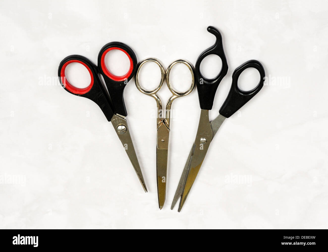 Three pairs of scissors against a white background Stock Photo - Alamy