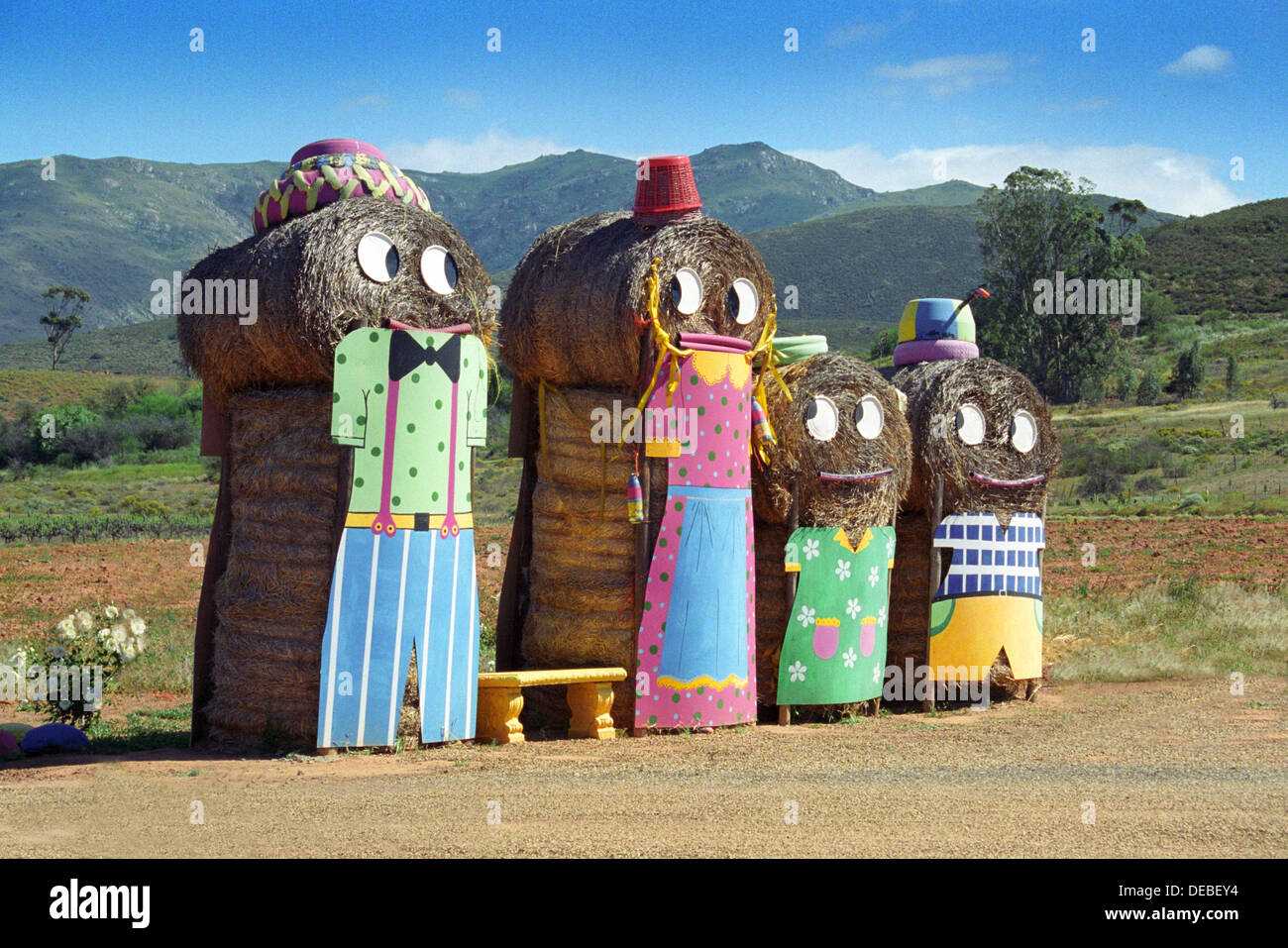 A comic group of characters made from hay bales in this rural landscape ...