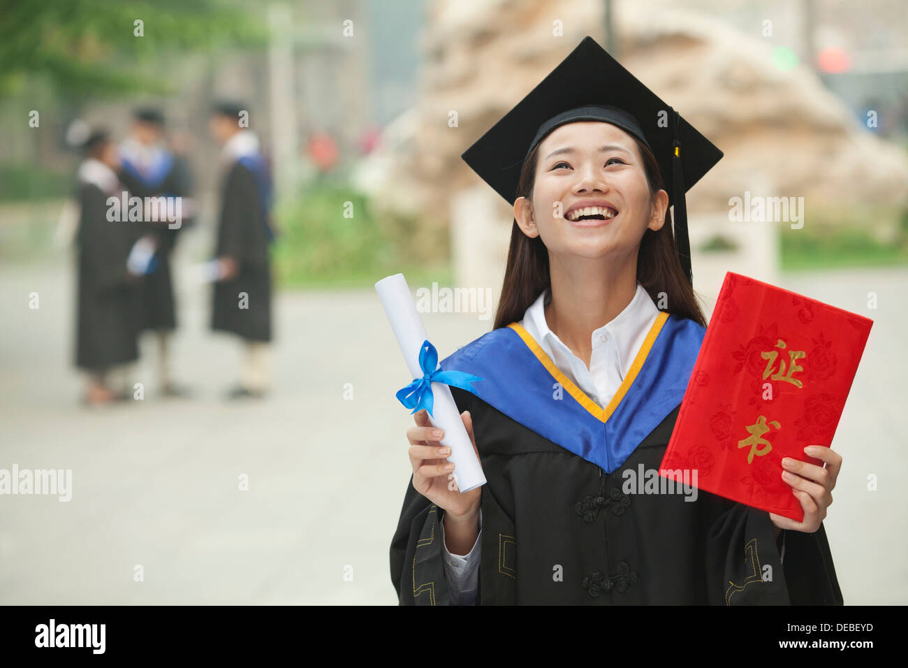Happy Graduate with Diploma Stock Photo - Alamy
