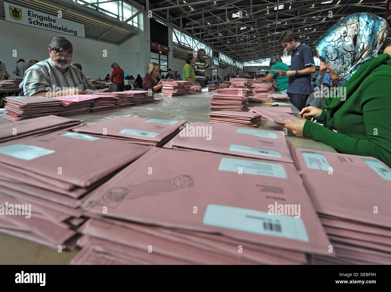 Election helpers sort the postal votes for the election of the Bavarian ...