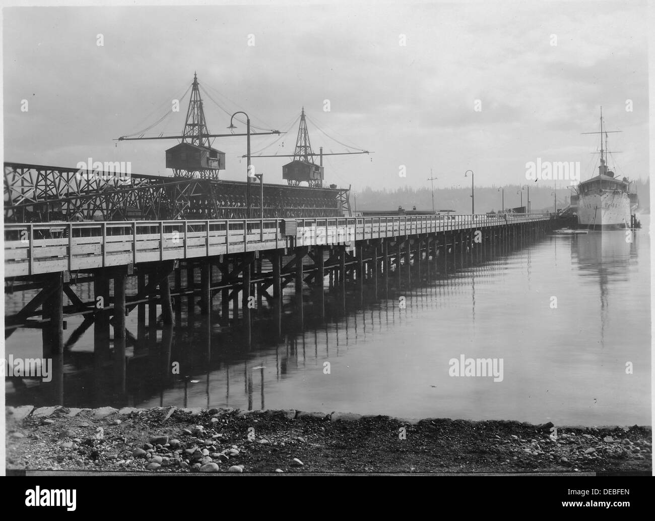 Photograph showing a receiving ship pier, an important facility in ...