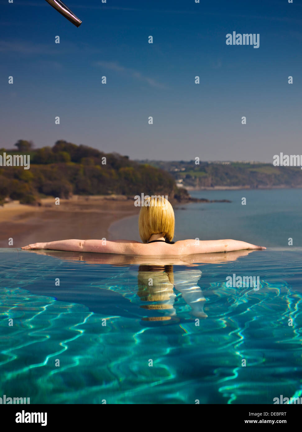 Woman relaxing in infinity pool, St.Brides Spa Hotel, Saundersfoot ...