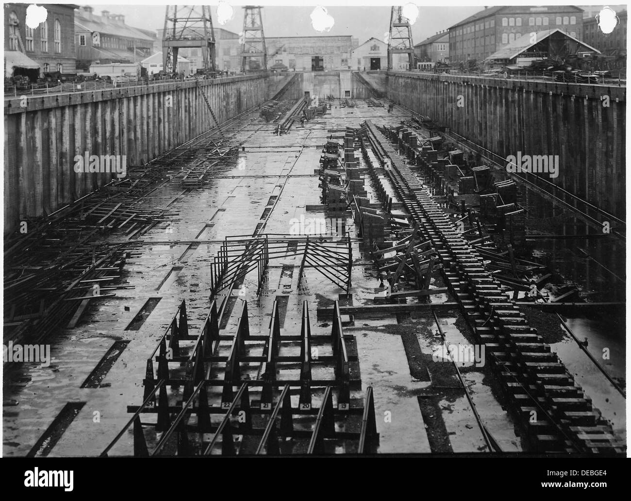 This image shows a general view of a shipbuilding dock looking north ...