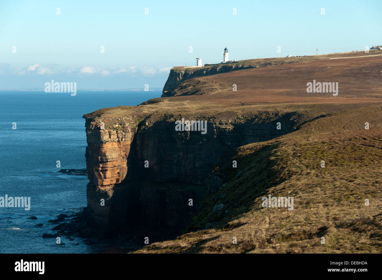 The lighthouse and cliffs from the west side of Dunnet Head, near ...