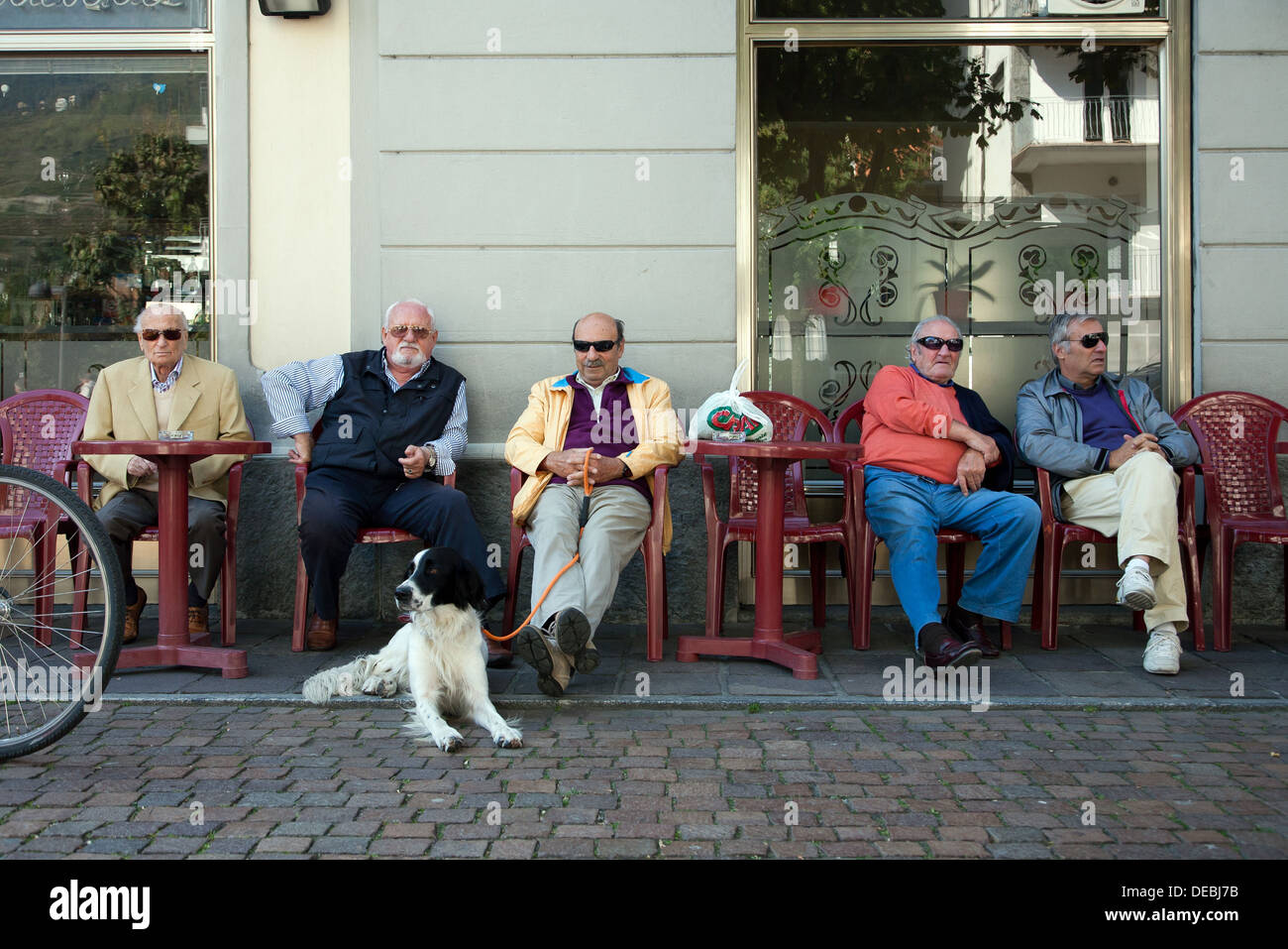 Tirano, Italy, pensioner sitting in a street cafe Stock Photo - Alamy