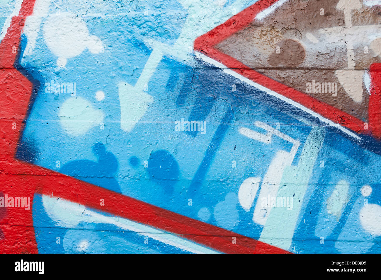 Graffiti closeup with arrows and blue dots Stock Photo - Alamy