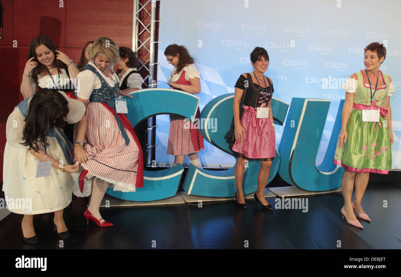 CSU-supporters in dirndl dresses pose with a party logo in the state ...