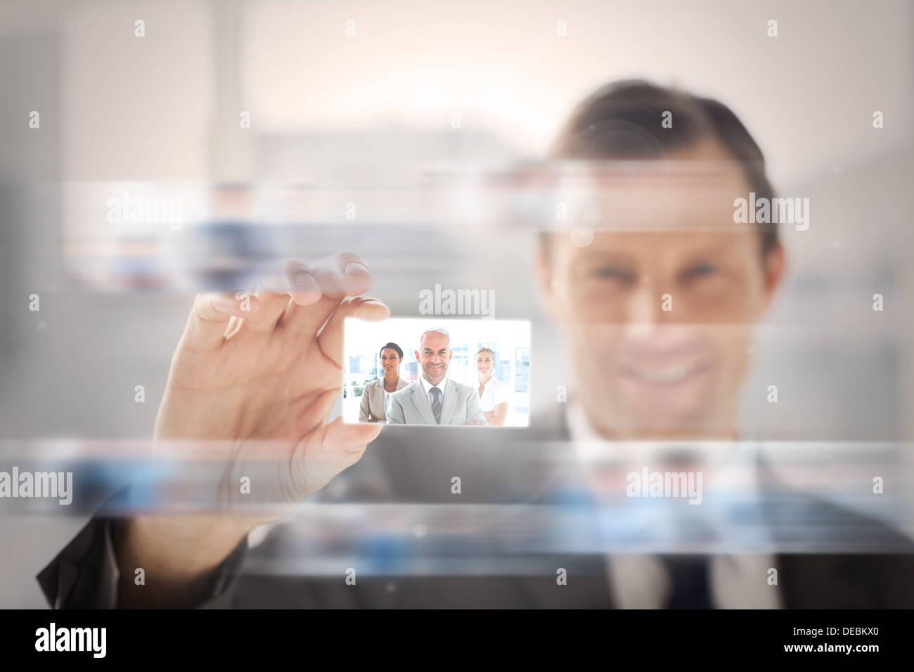 Pleased businessman presenting a picture of business team Stock Photo ...