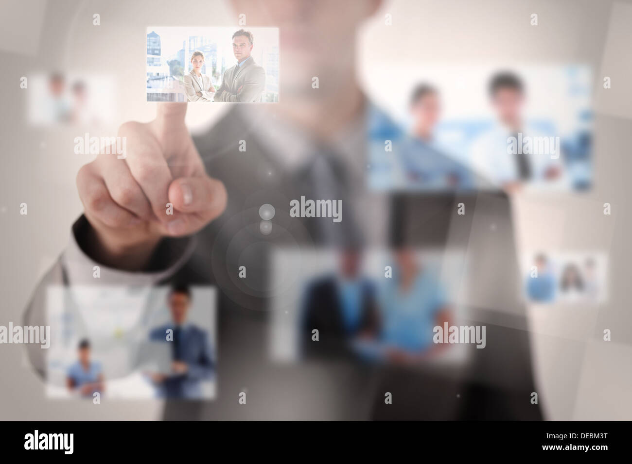 Businessman selecting a picture Stock Photo - Alamy